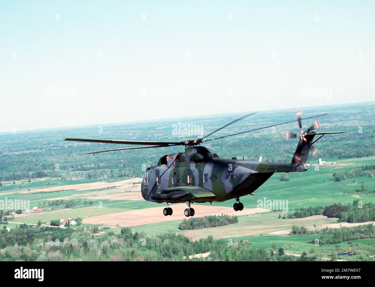 Left rear view of an HH-3E Jolly Green Giant helicopter in flight ...