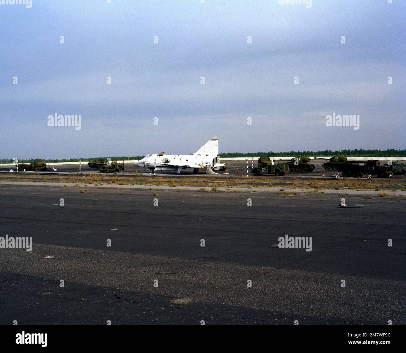 A view of damage to a target aircraft and several vehicles on Eglin ...