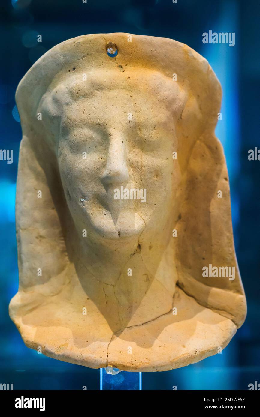 Terracotta female mask of the type with an arching diadem pierced at ...