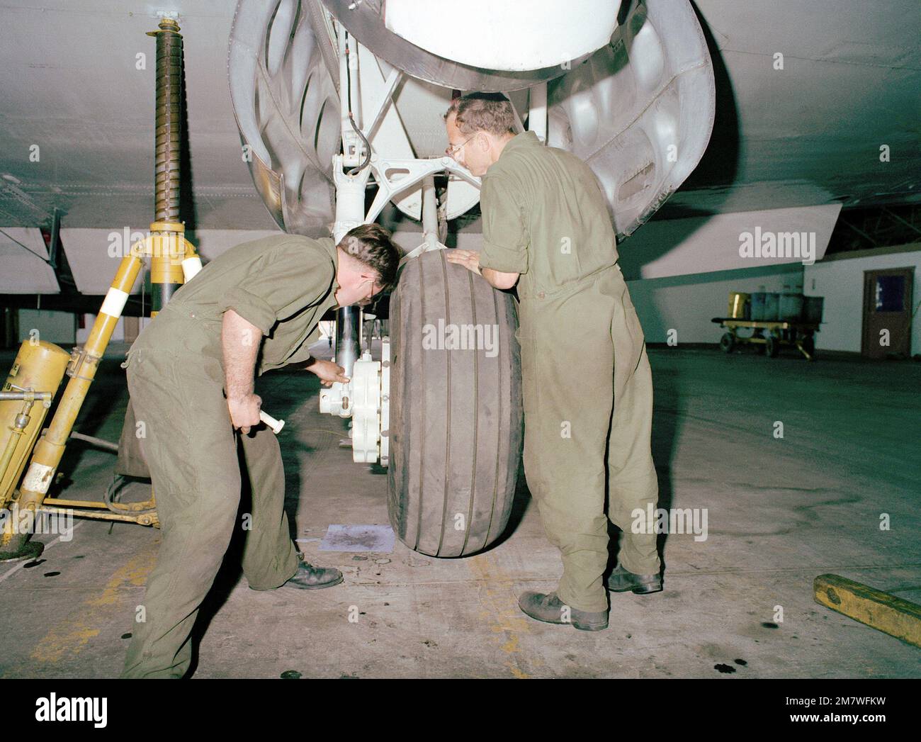 SGT B.E. Stephenson and CPL P.D. Hass help to prepare this Douglas C ...