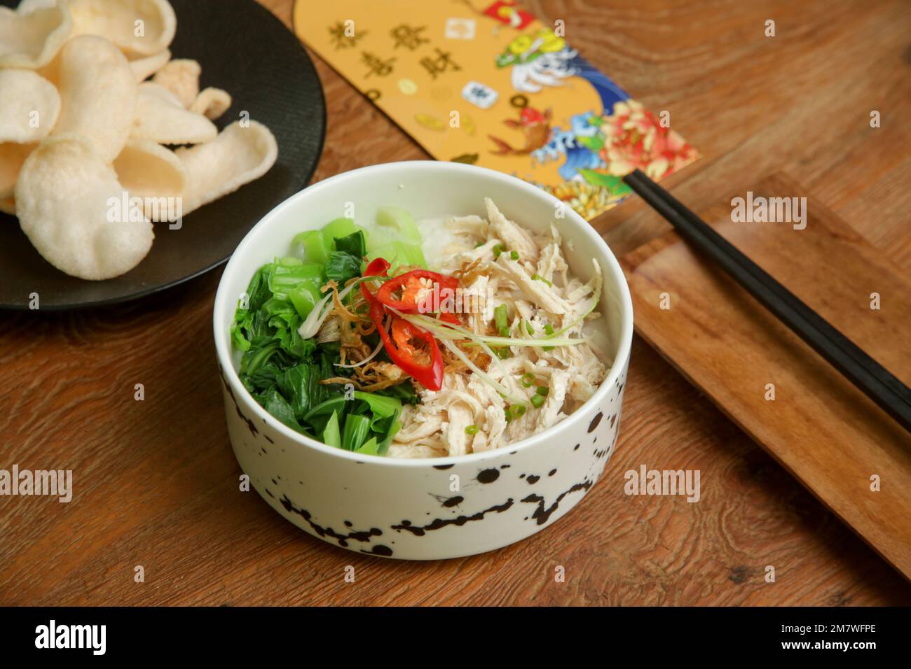 Foods to eat on Lunar New Year’s Eve on the table with golden envelope ...