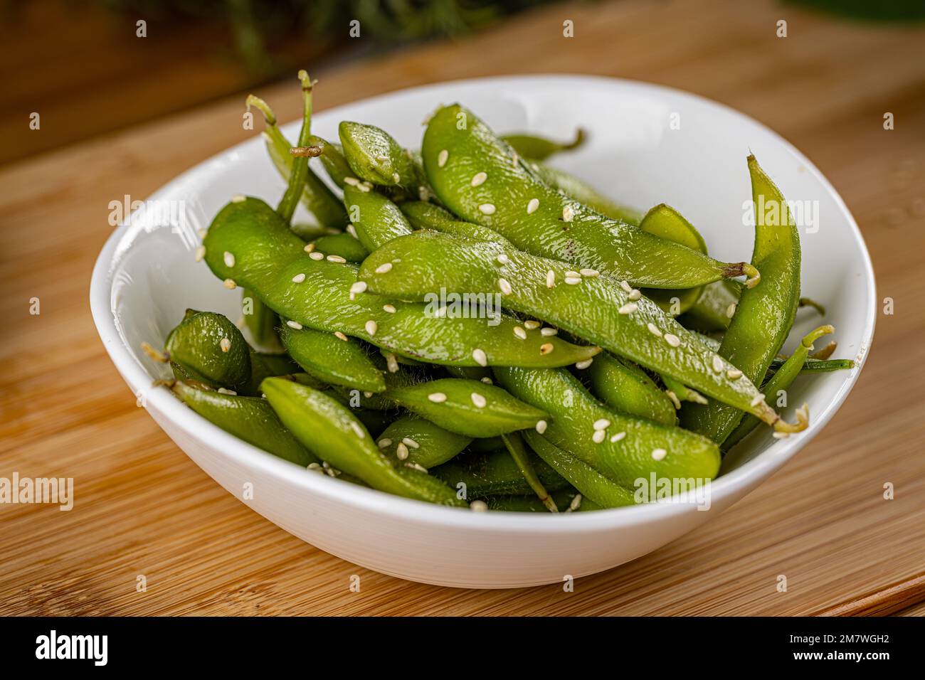 Chinese style pods. Edamame or soybeans with sesame seeds Stock Photo ...