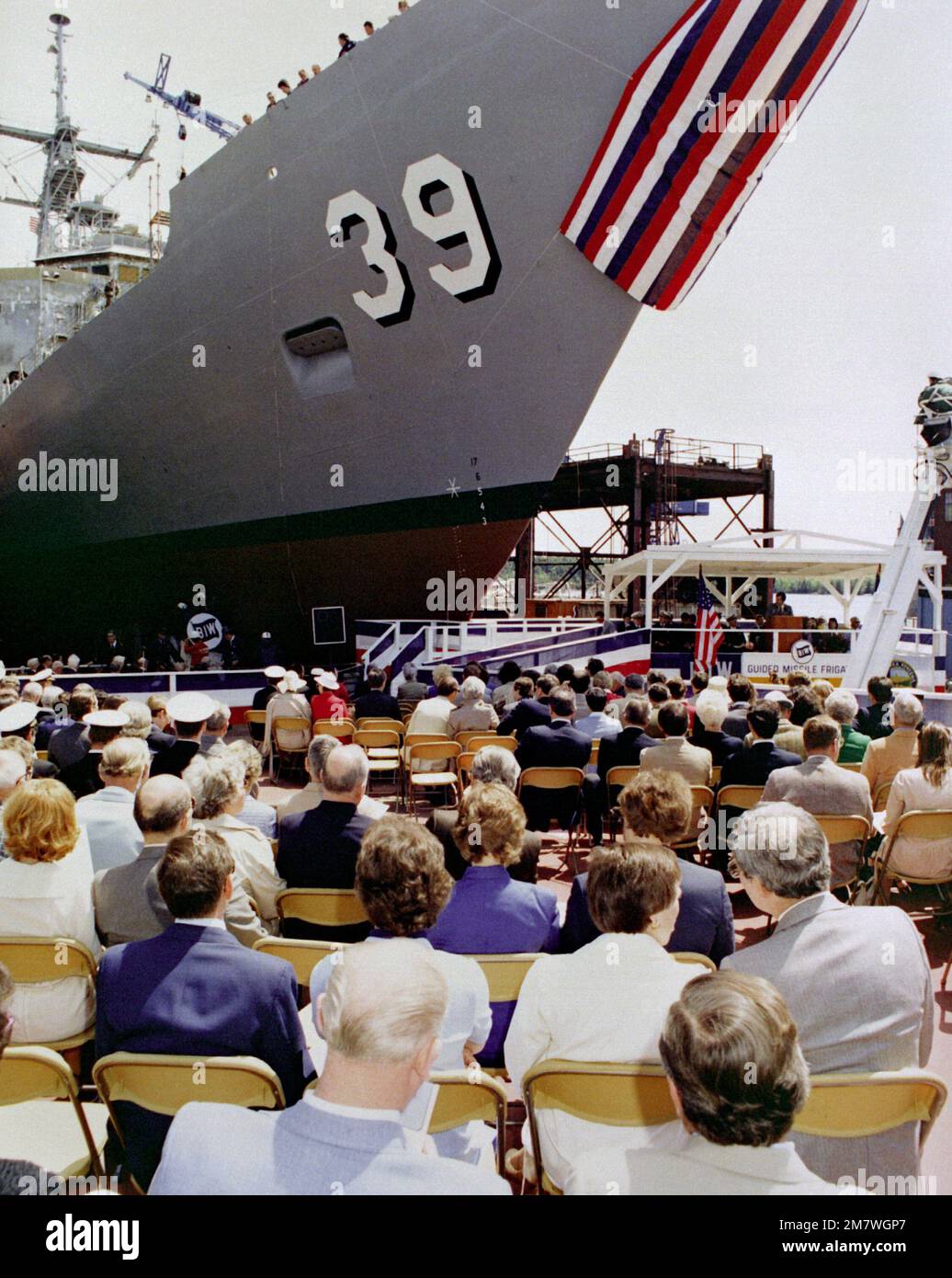 Guests listen to a speaker during the launching ceremony of the guided ...