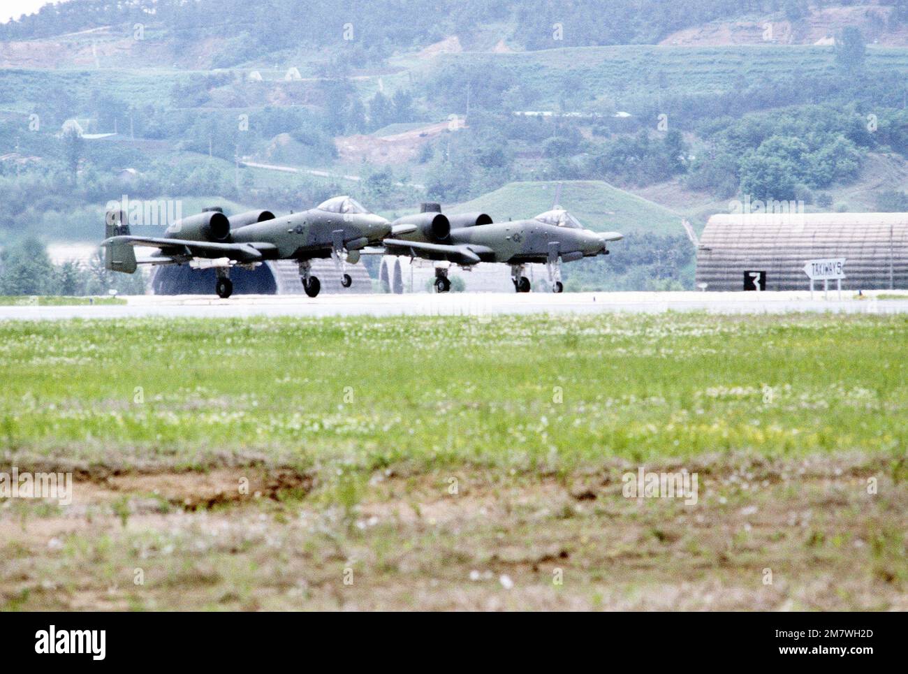 A right front view of two A-10 Thunderbolt II aircraft from the 25th ...