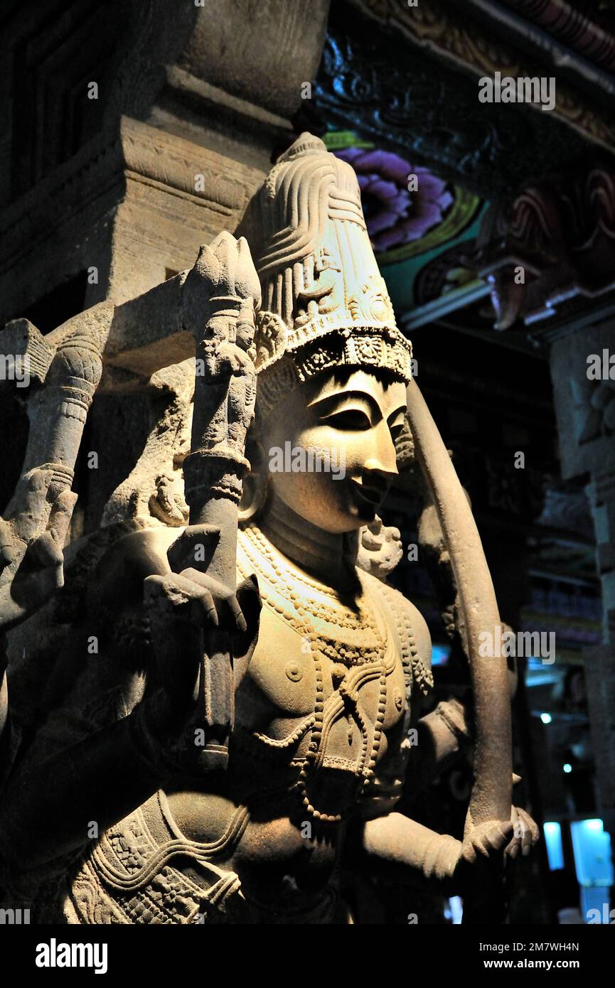 Statues of a woman Dwarpal guard in stone at Meenakshi Temple in ...