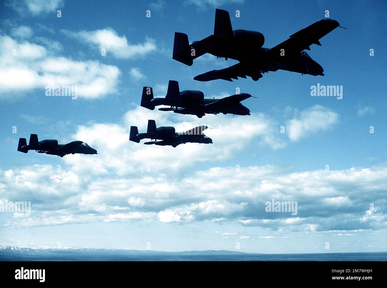 A view of a four-ship wedge formation of A-10 Thunderbolt II aircraft ...
