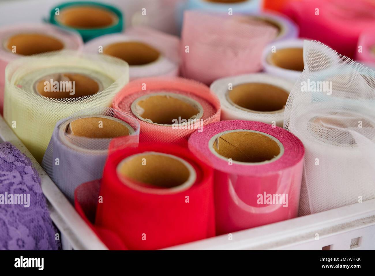 Roll fabrics displayed in a traditional market Stock Photo - Alamy