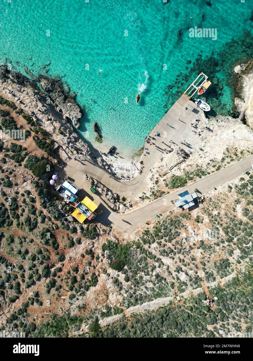 A vertical aerial top view of a bright blue lagoon in Malta Stock Photo ...