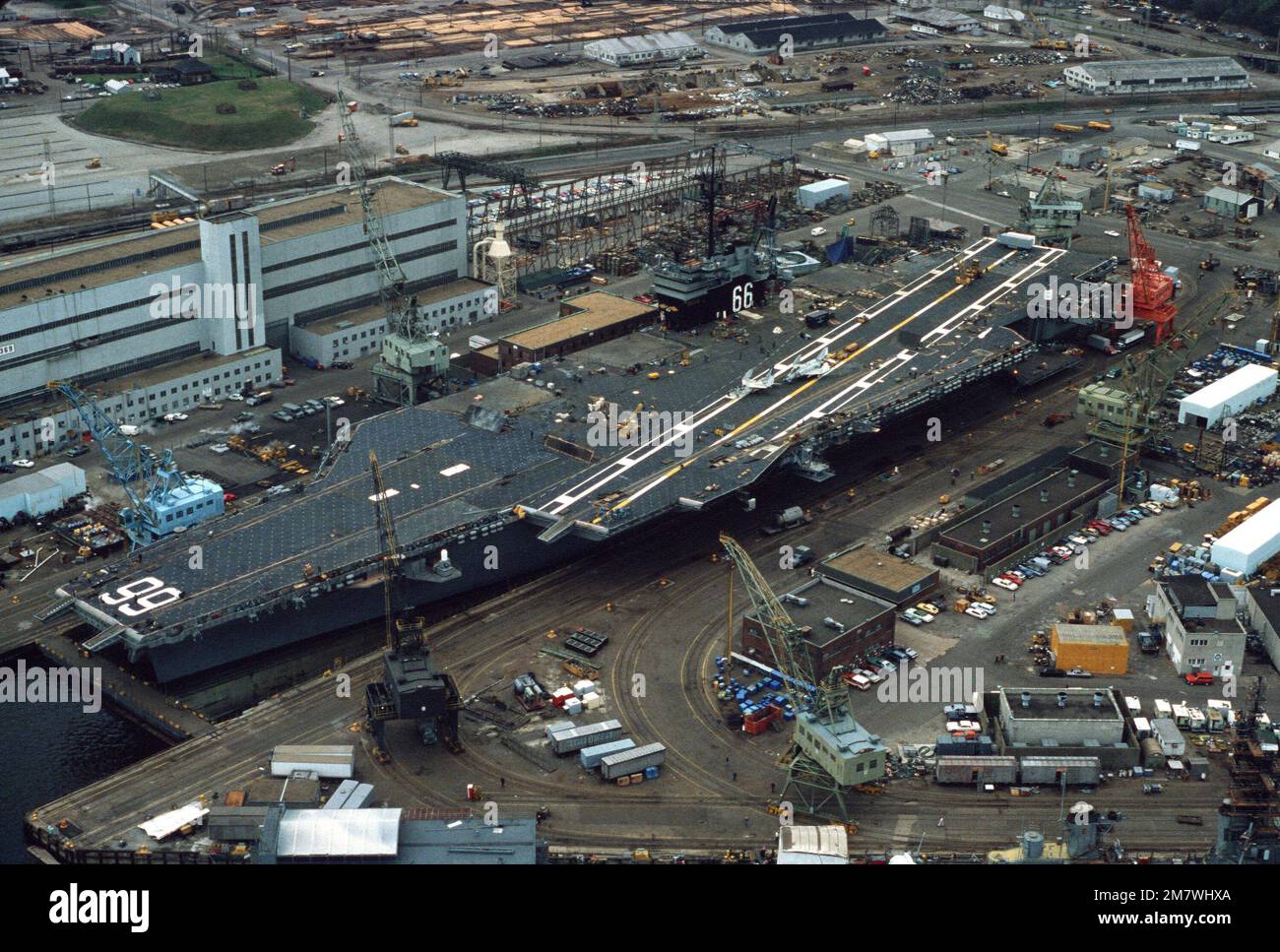 An aerial view of the aircraft carrier USS AMERICA (CV 66) in dry dock ...