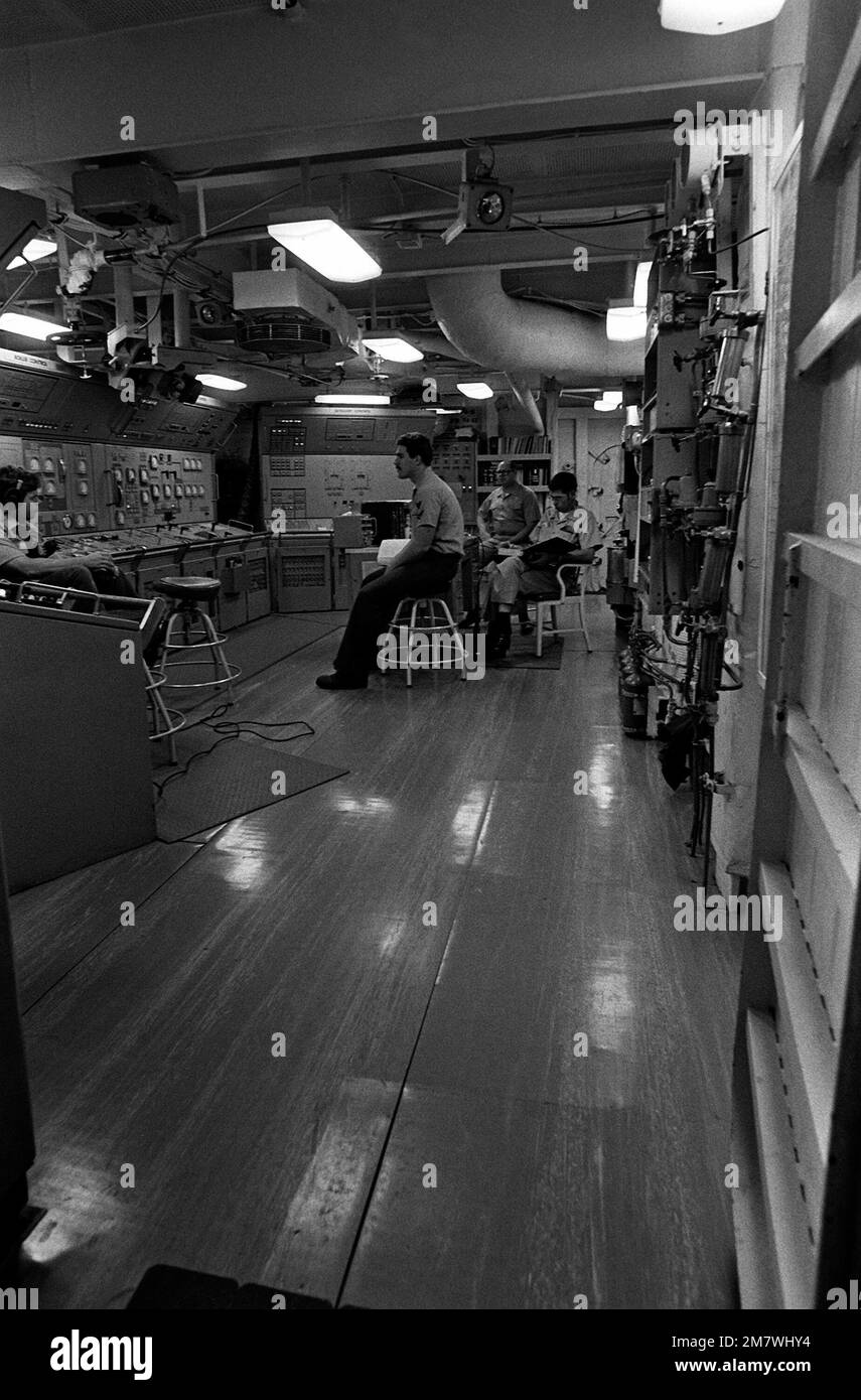Crewmen prepare for a replenishment operation in the engineering main ...