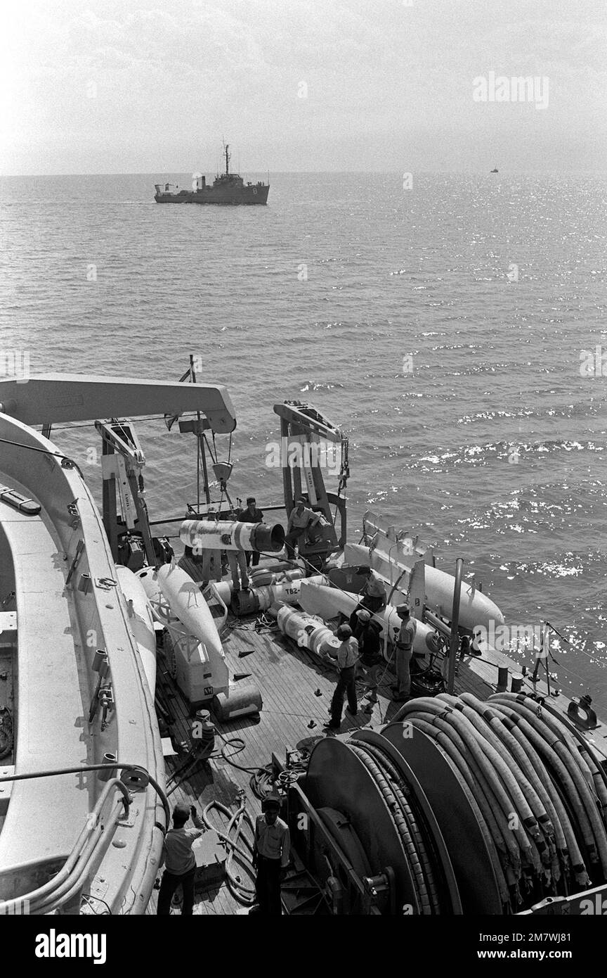 Royal Thai navy personnel transfer recovered mines to the support ship ...