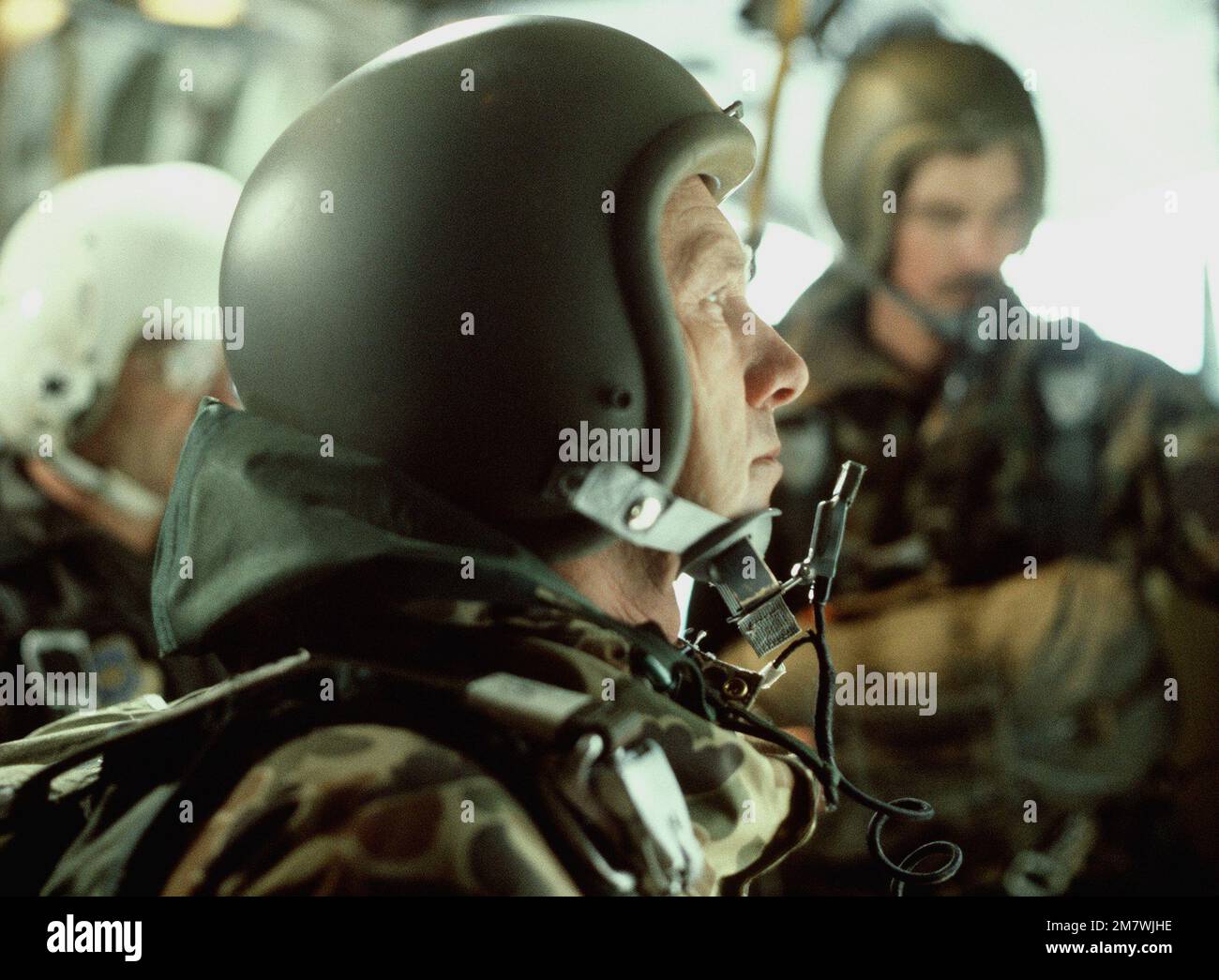 A view of a search and rescue crew chief as he waits to jump from a C ...