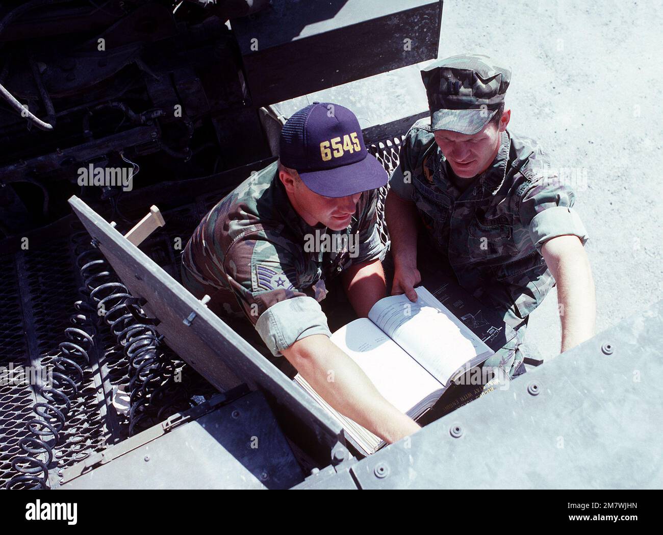 SSGT Dave Hillman and CPT Rick Sample man the control panel of a ...