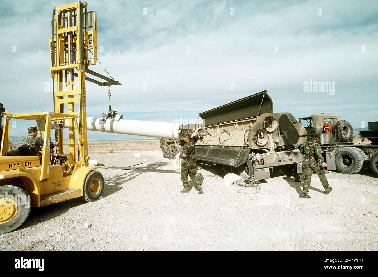 Air Force personnel load a ground-launched cruise missile into the ...