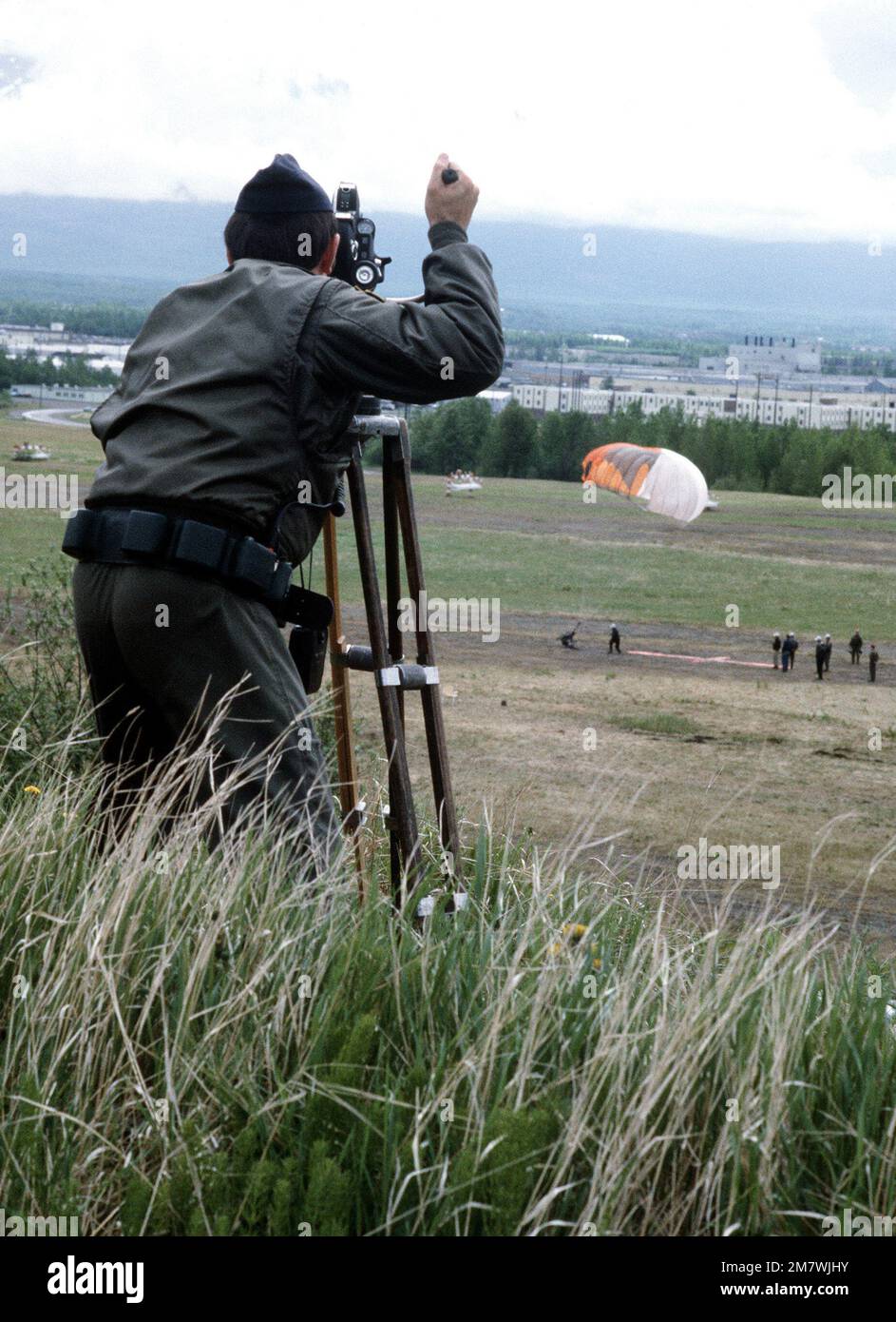A cameraman films a Canadian search and rescue team member as he ...