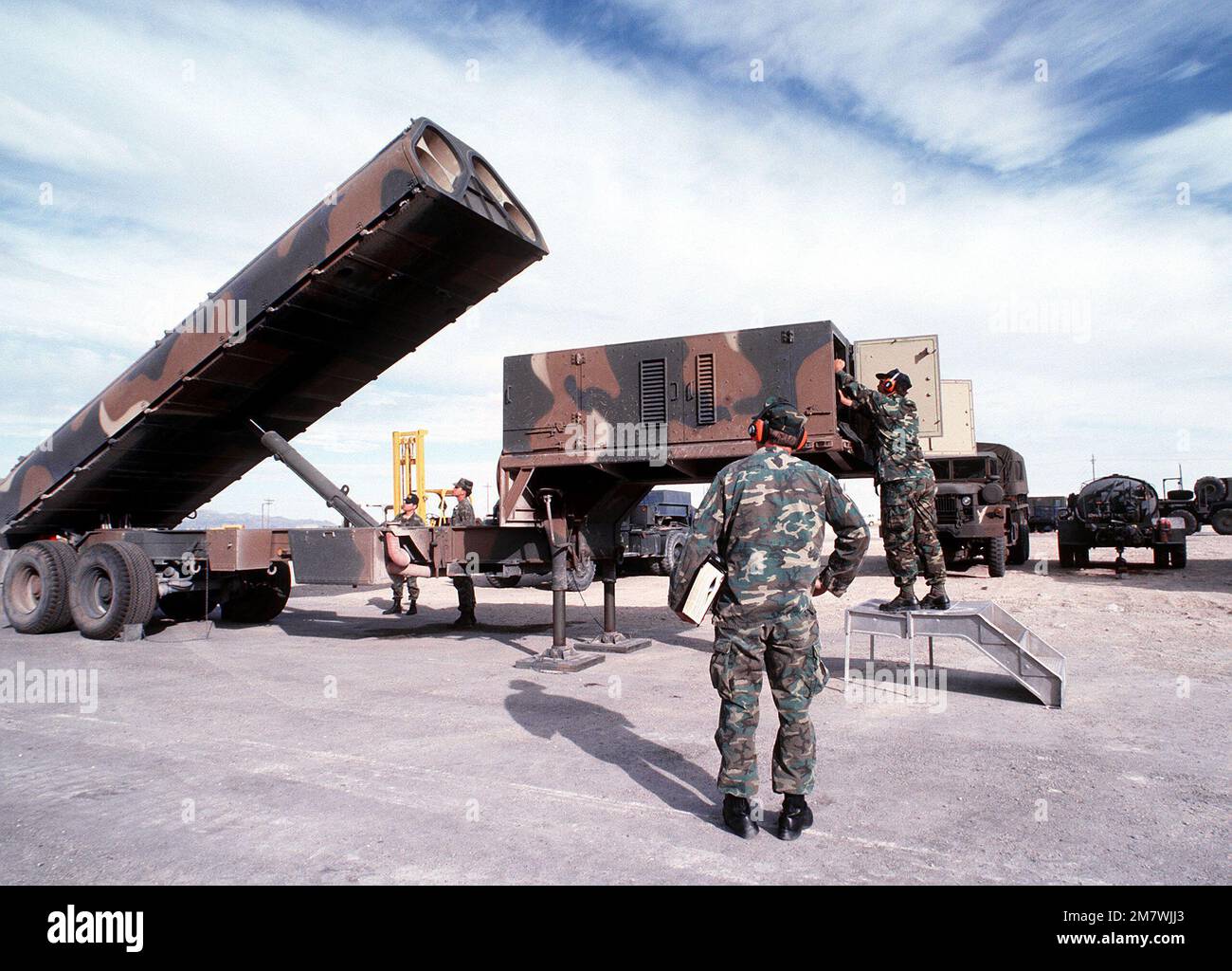 Crewmen check out the transporter-erector-launcher for the Air Force ...