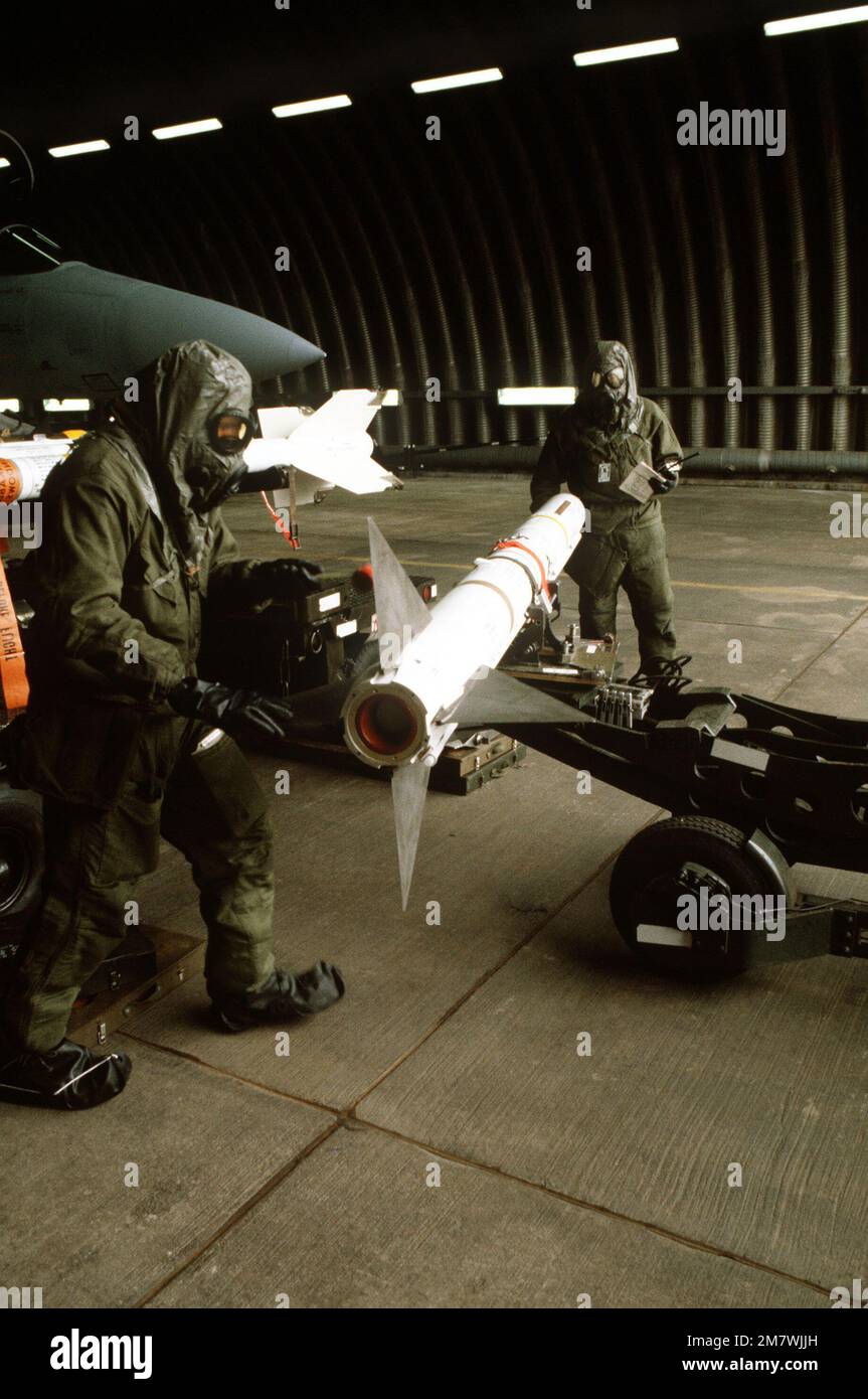 Members of the 1ST Tactical Fighter Wing remove an AIM-9 Sidewinder ...