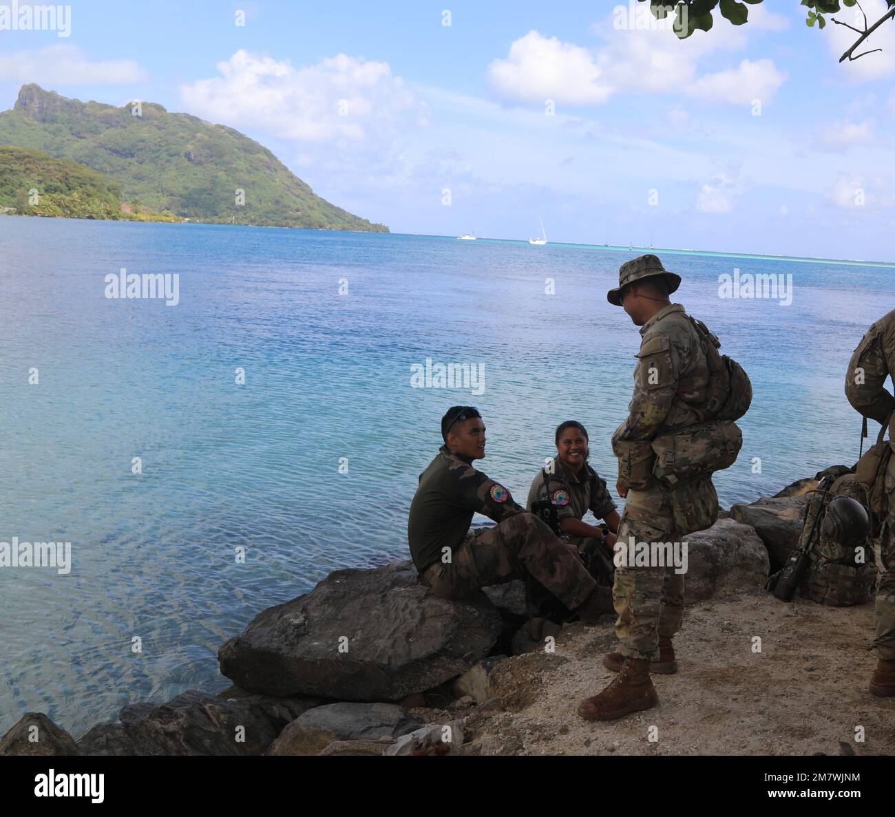 U.S. and French soldiers take a break after establishing tactical ...