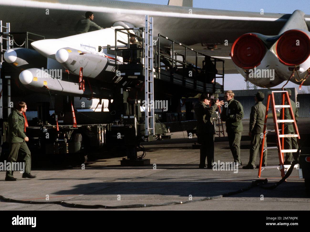 Air-launched cruise missiles (ALCM) are mounted to the wing of a B-52G ...
