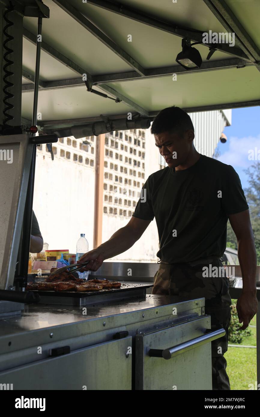 A French Polynesia soldier prepares chicken in a French tactical mobile ...