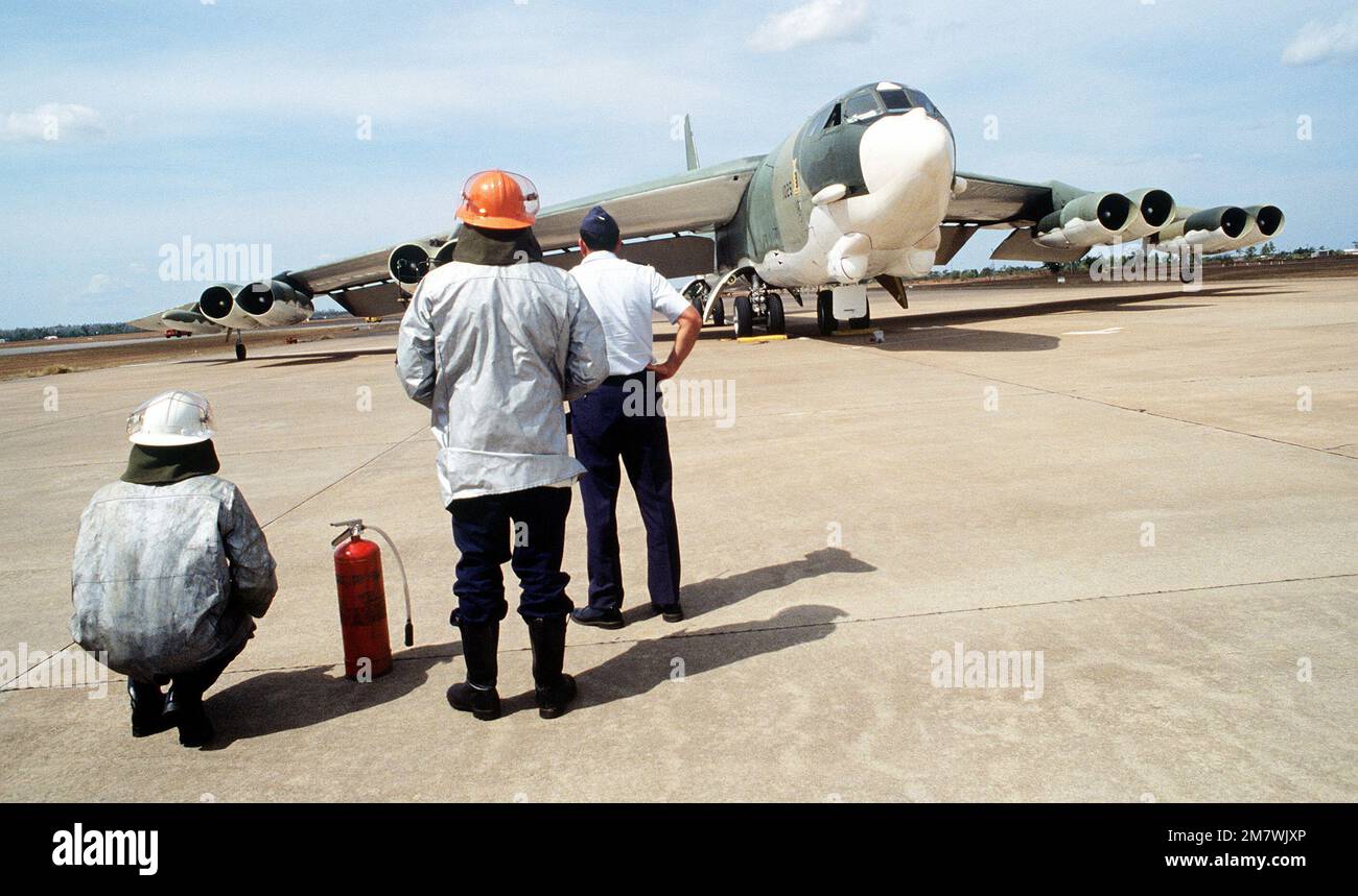 A fire protection crew stands by as a B-52H Stratofortress aircraft is ...