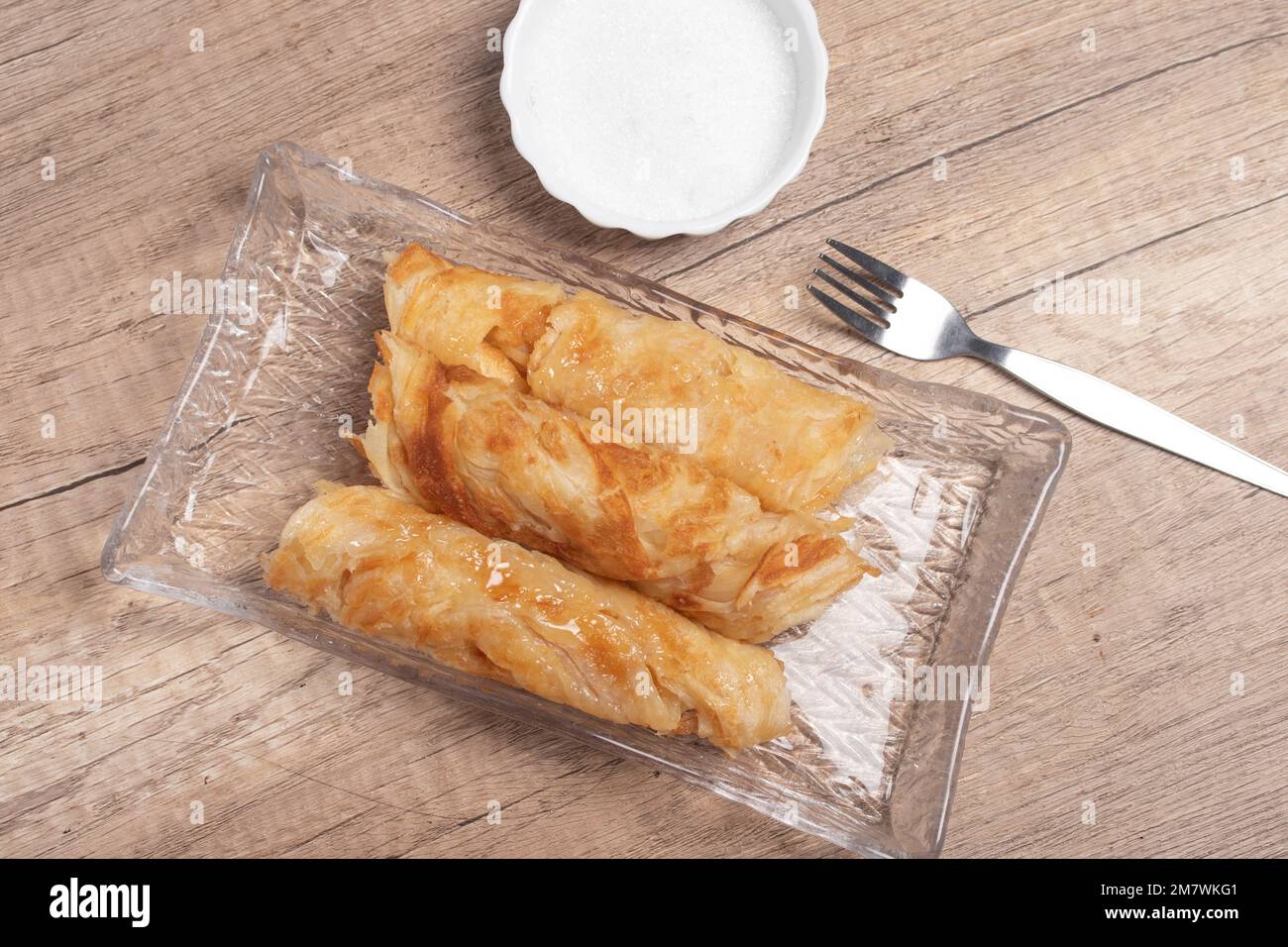 Fried Roti with Sweetened Condensed Milk Thai Dessert Stock Photo - Alamy