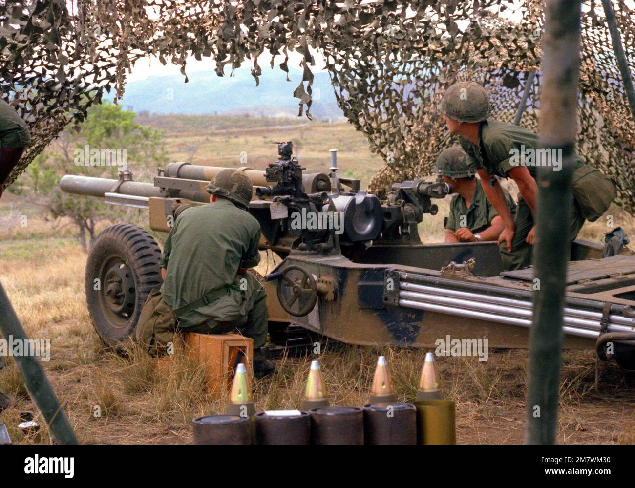 A gunnery crew from Battery A, 321st Field Artillery, line up the ...