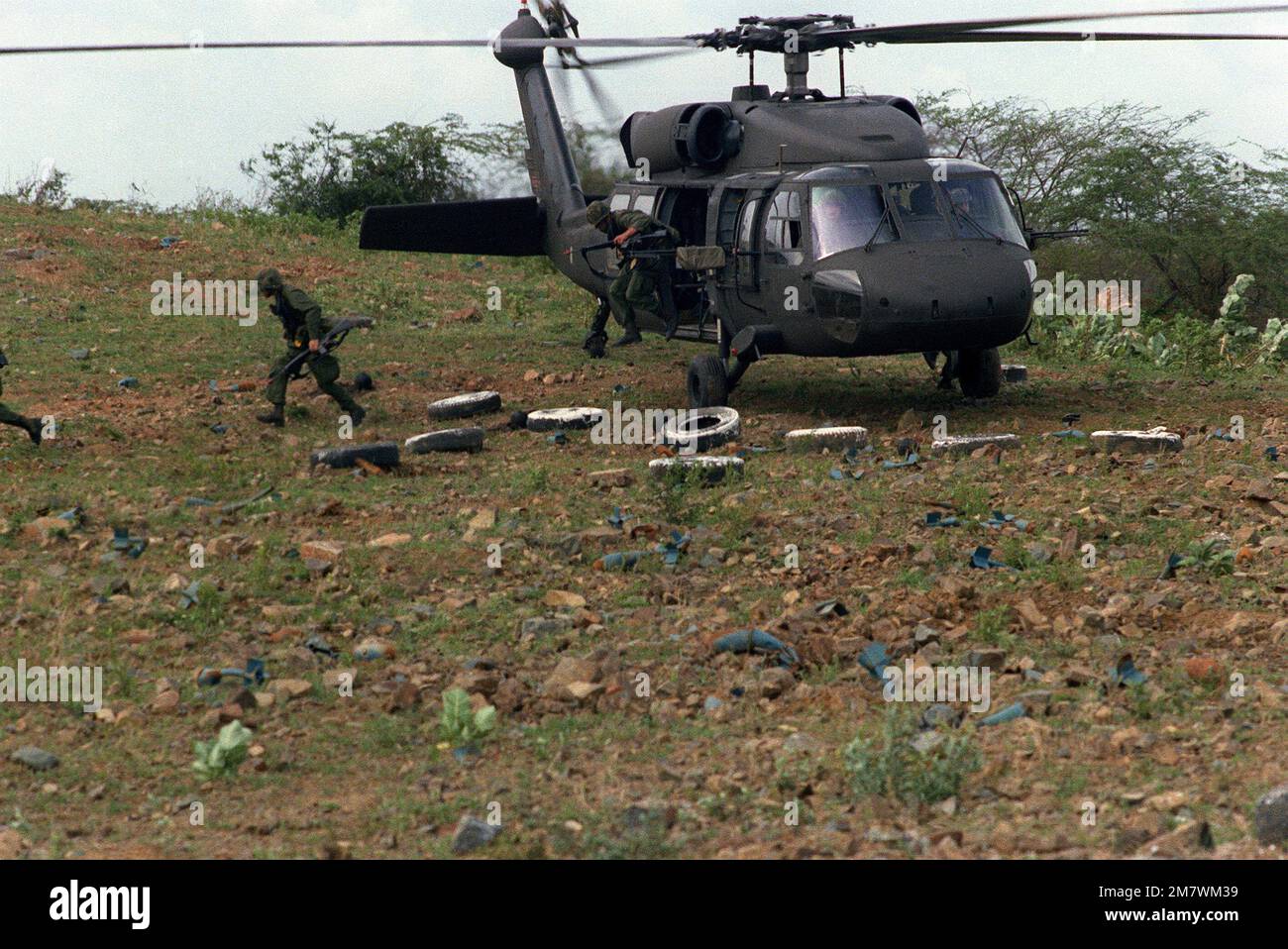Infantrymen from Company C, 502nd Infantry exit a UH-60A Black Hawk ...