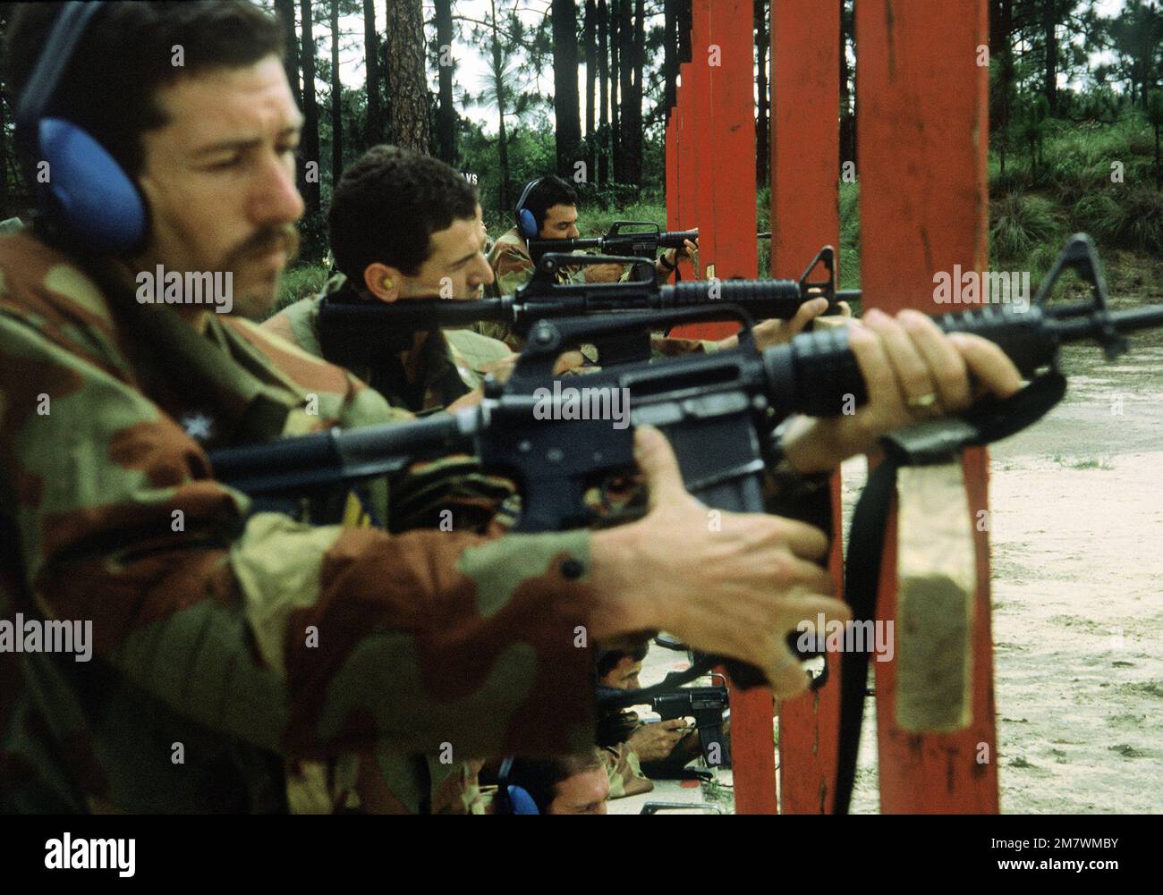 Italian team members fire M-16 rifles on a practice range during Volant ...