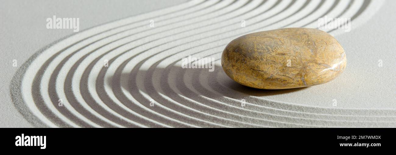 Japanese zen garden with stone in textured sand Stock Photo - Alamy