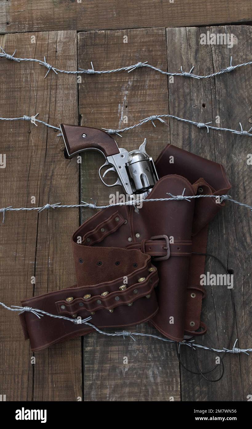 A still life of A wild west American 6 gun (colt) with holster and ...