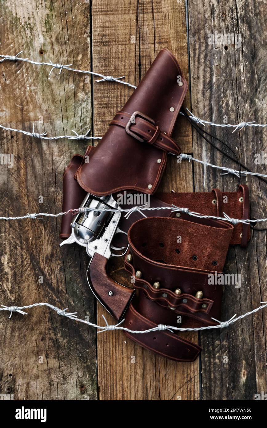 A still life of A wild west American 6 gun (colt) with holster and ...