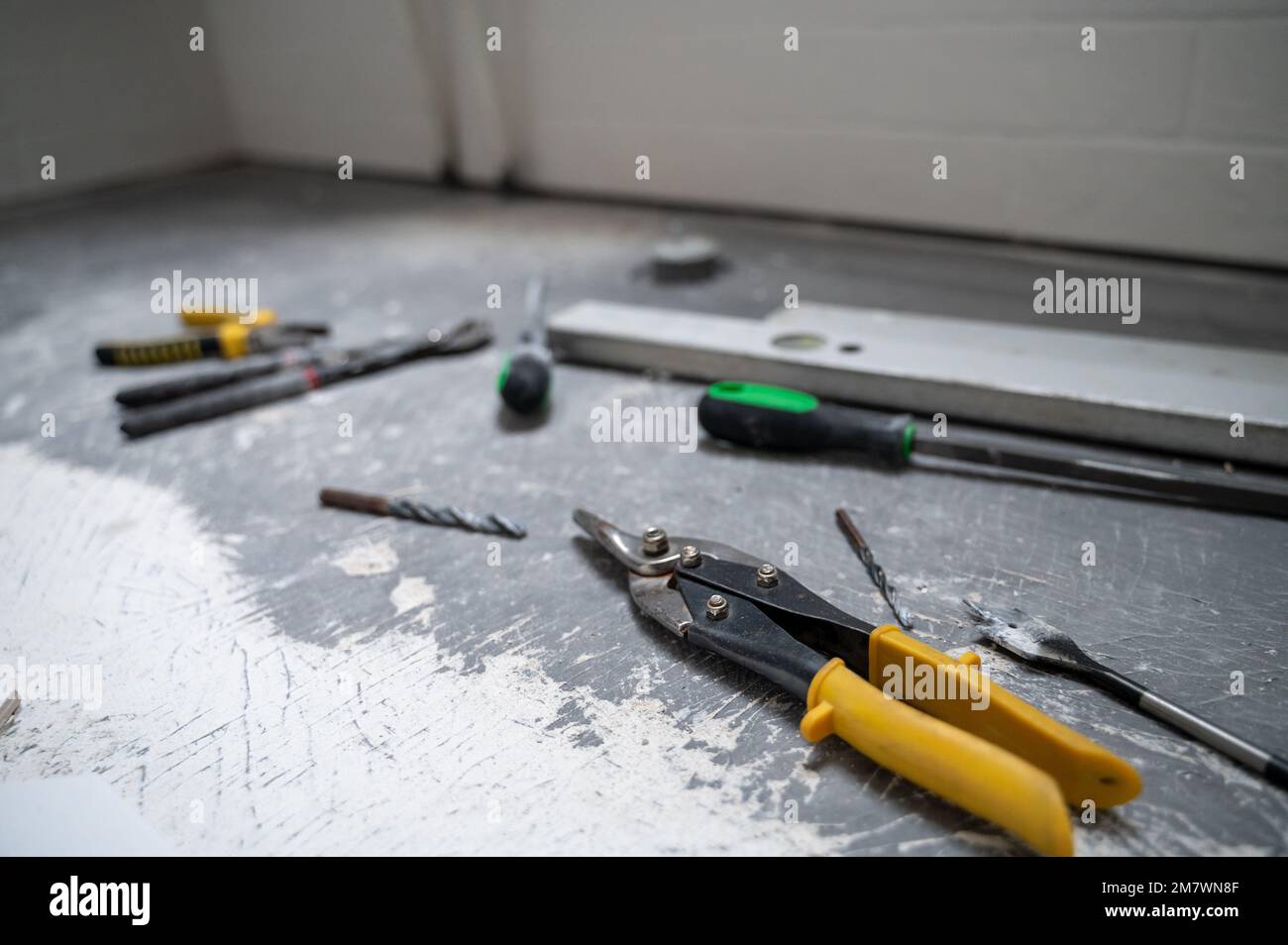Tools in apartment renovation area on floor Stock Photo - Alamy