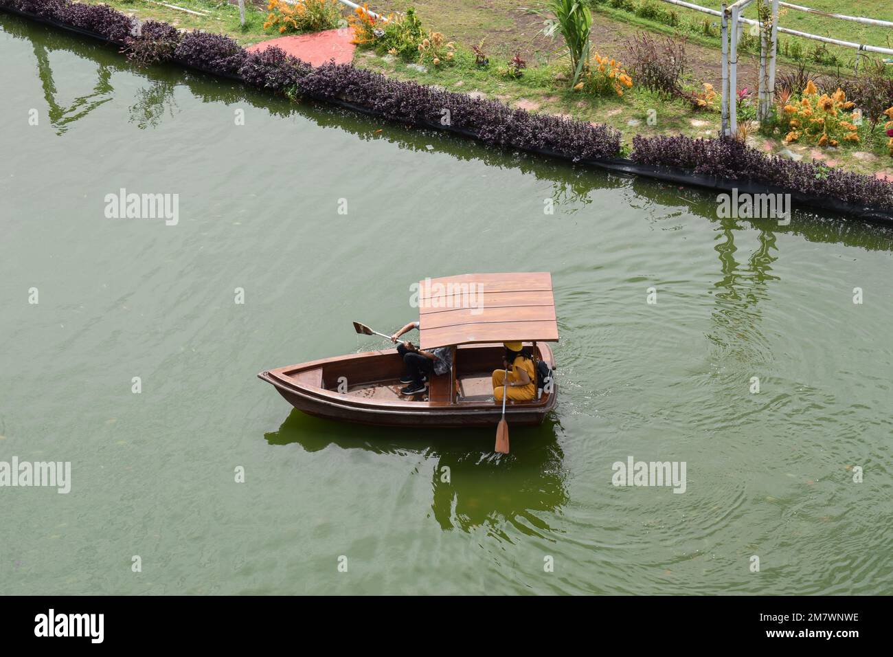 Row boat tour Wooden Boat With Pedals with beautiful mountains view. At ...