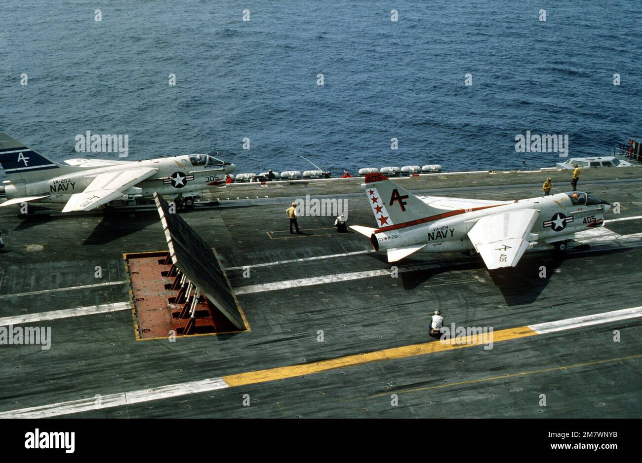 Two A-7B Corsair II aircraft are ready for launch during flight ...