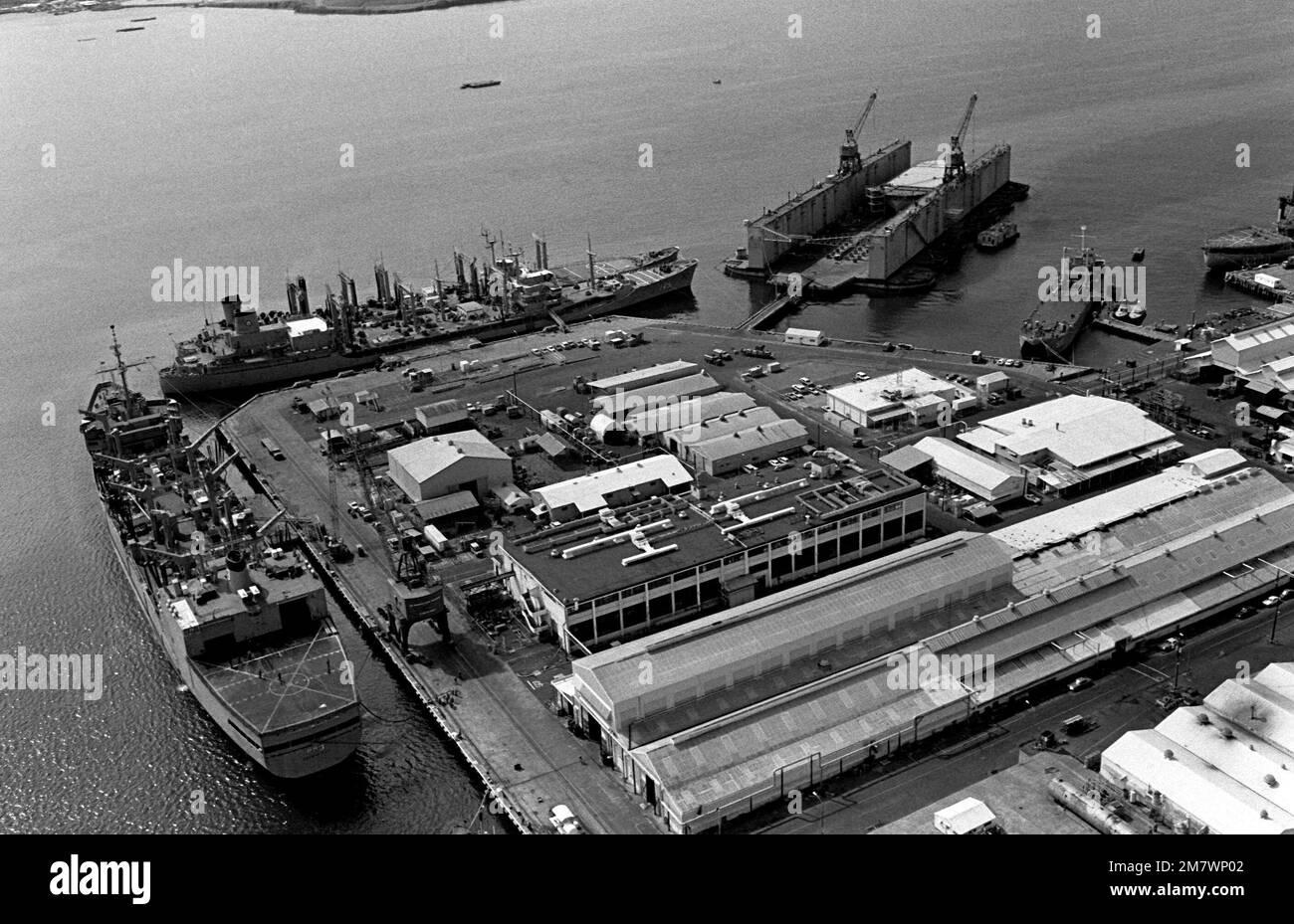 An aerial view of the US Naval Ship Repair Facility. Berthed at the ...