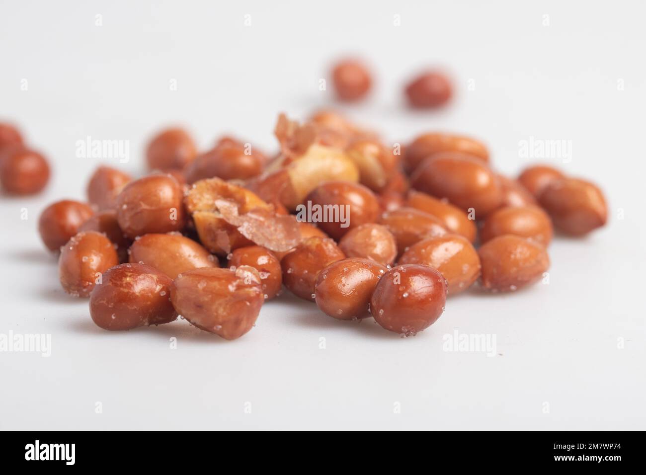 salted fried peanuts on white background Stock Photo - Alamy