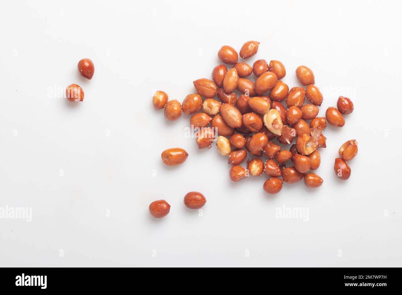 salted fried peanuts on white background Stock Photo - Alamy