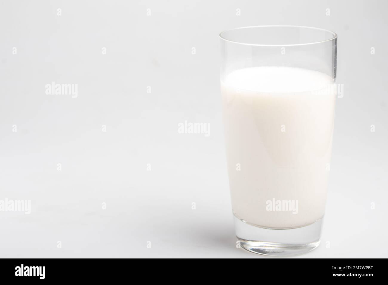 fresh milk in transparent glass on white background Stock Photo - Alamy