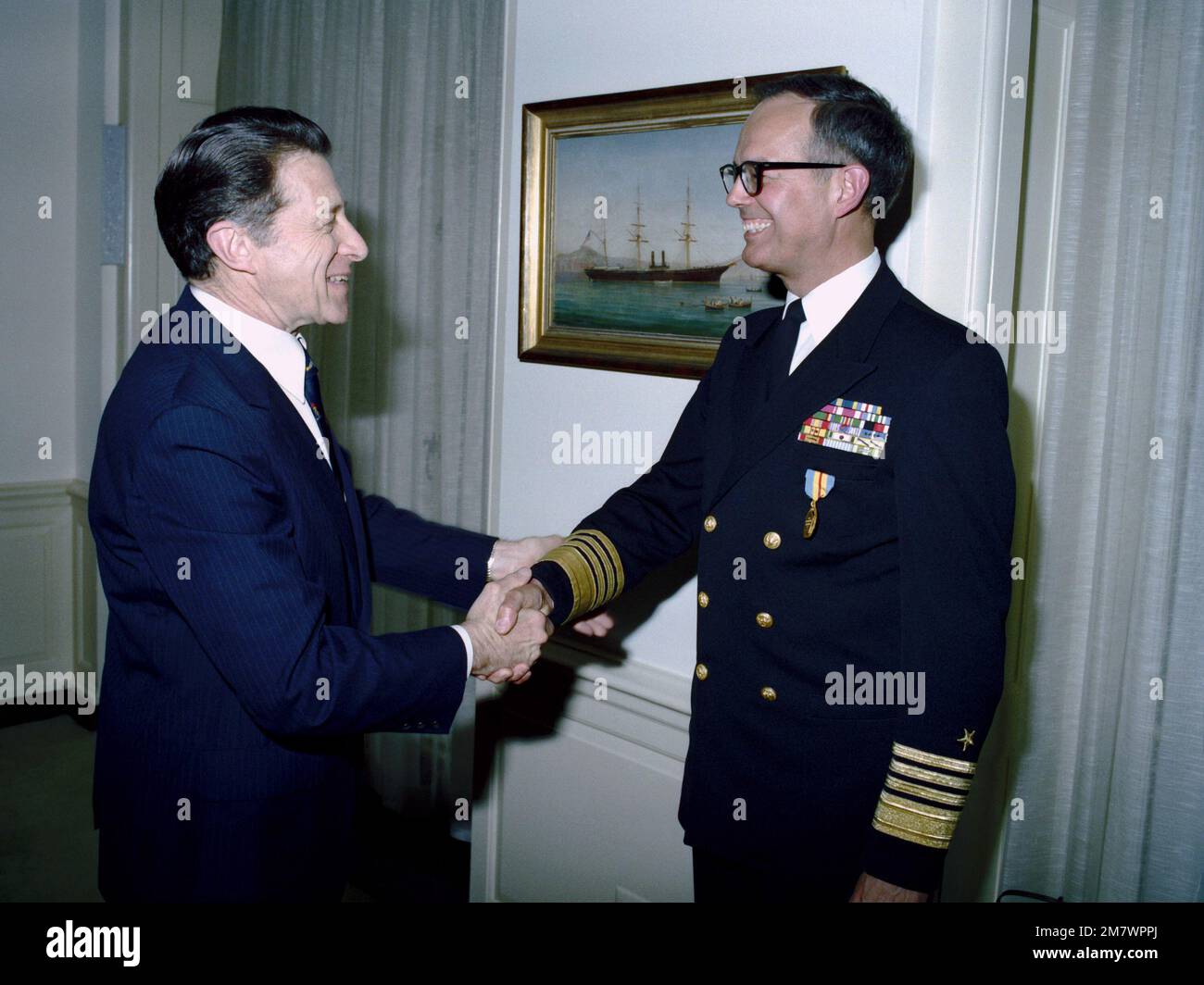 Secretary of Defense Casper W. Weinberger presents Admiral Bobby R ...