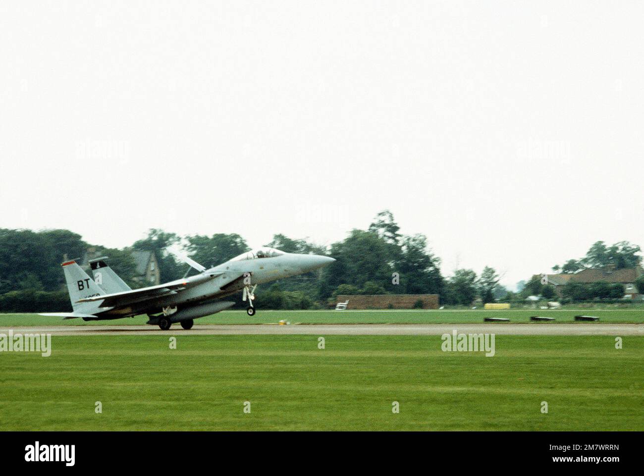 A right side view of an F-15 Eagle aircraft as it takes off during ...