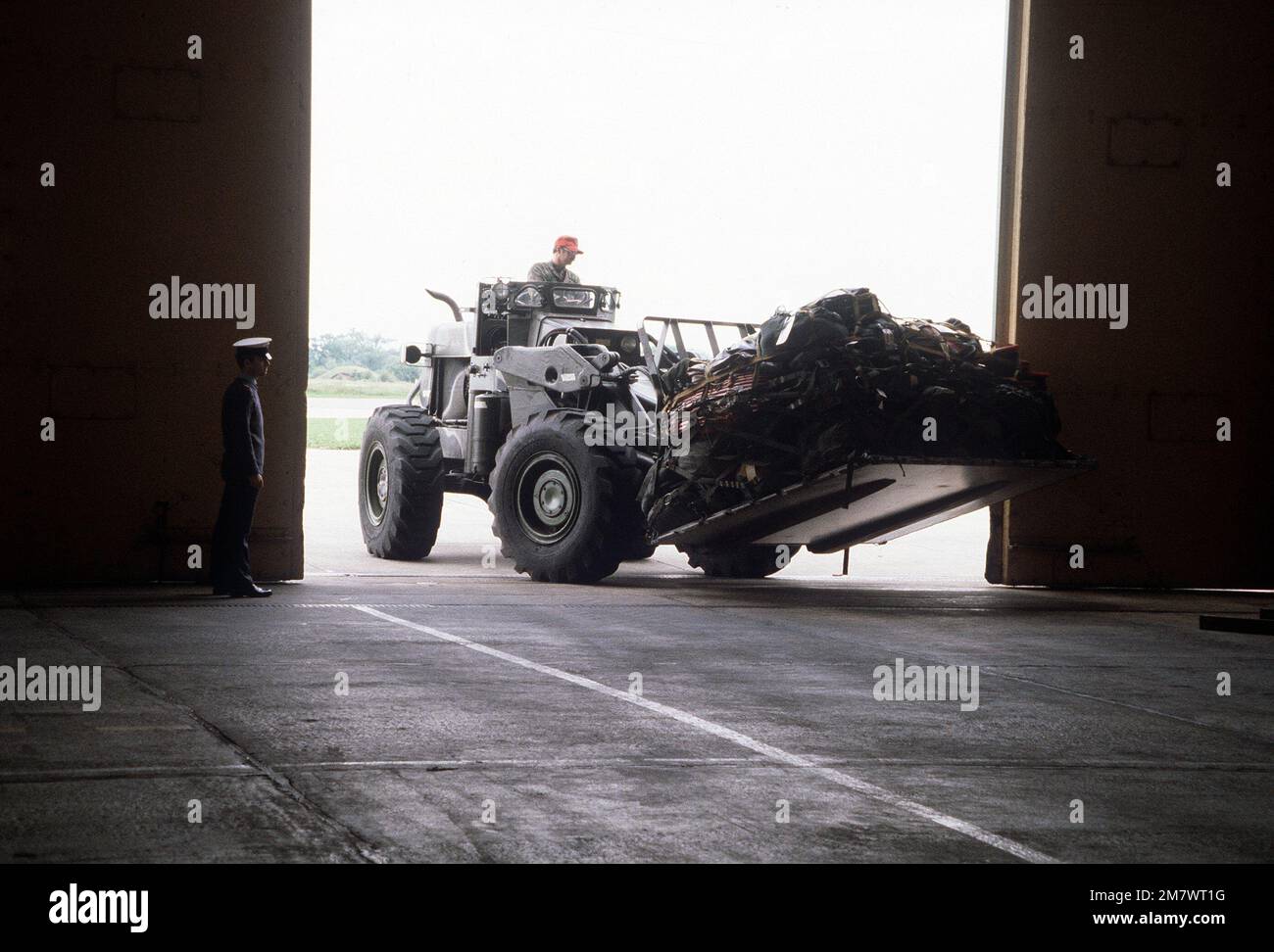 A pallet of United States Air Force luggage is being carried on a ...
