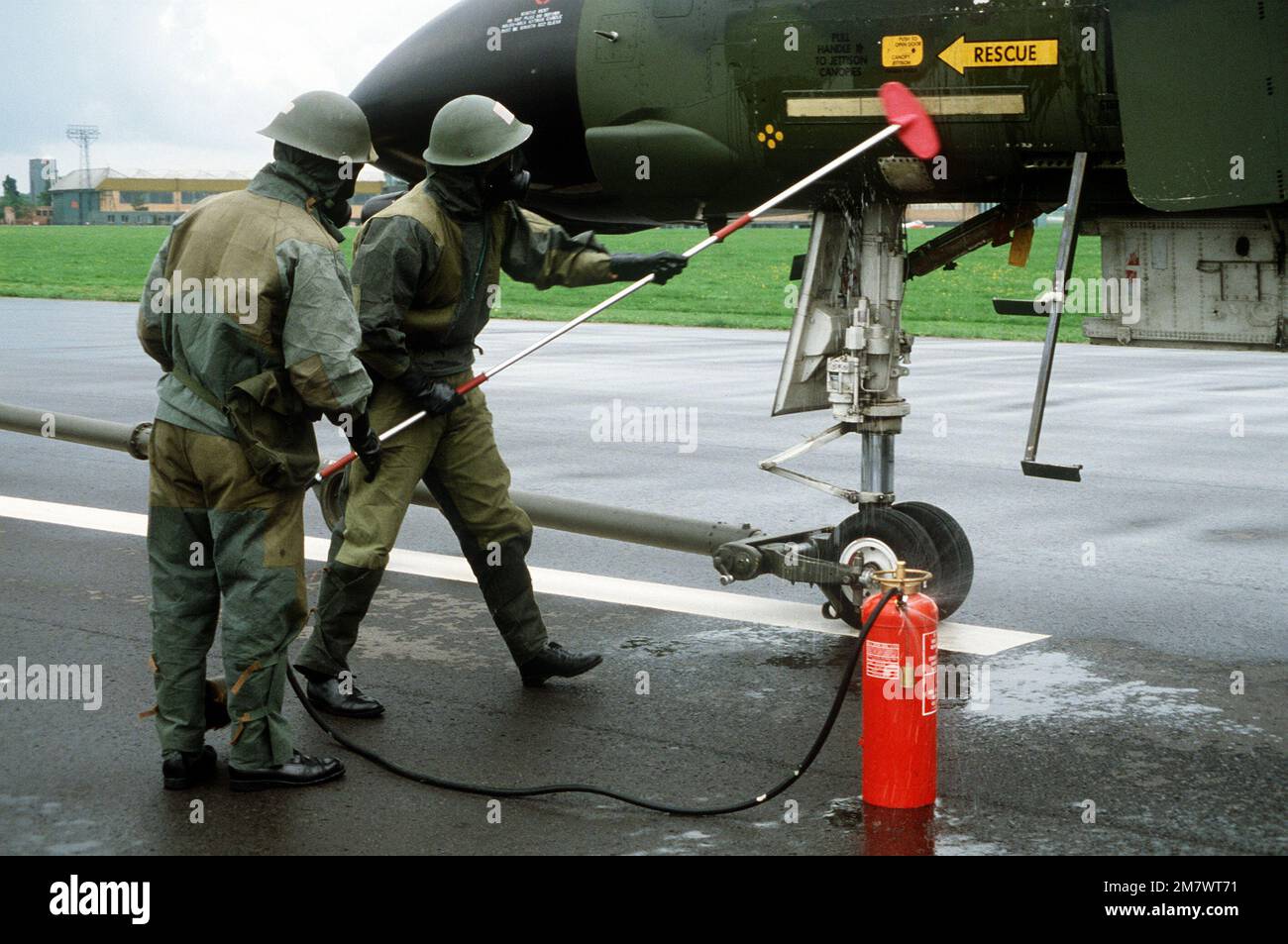 British Royal Air Force members decontaminate an F-C Phantom II ...