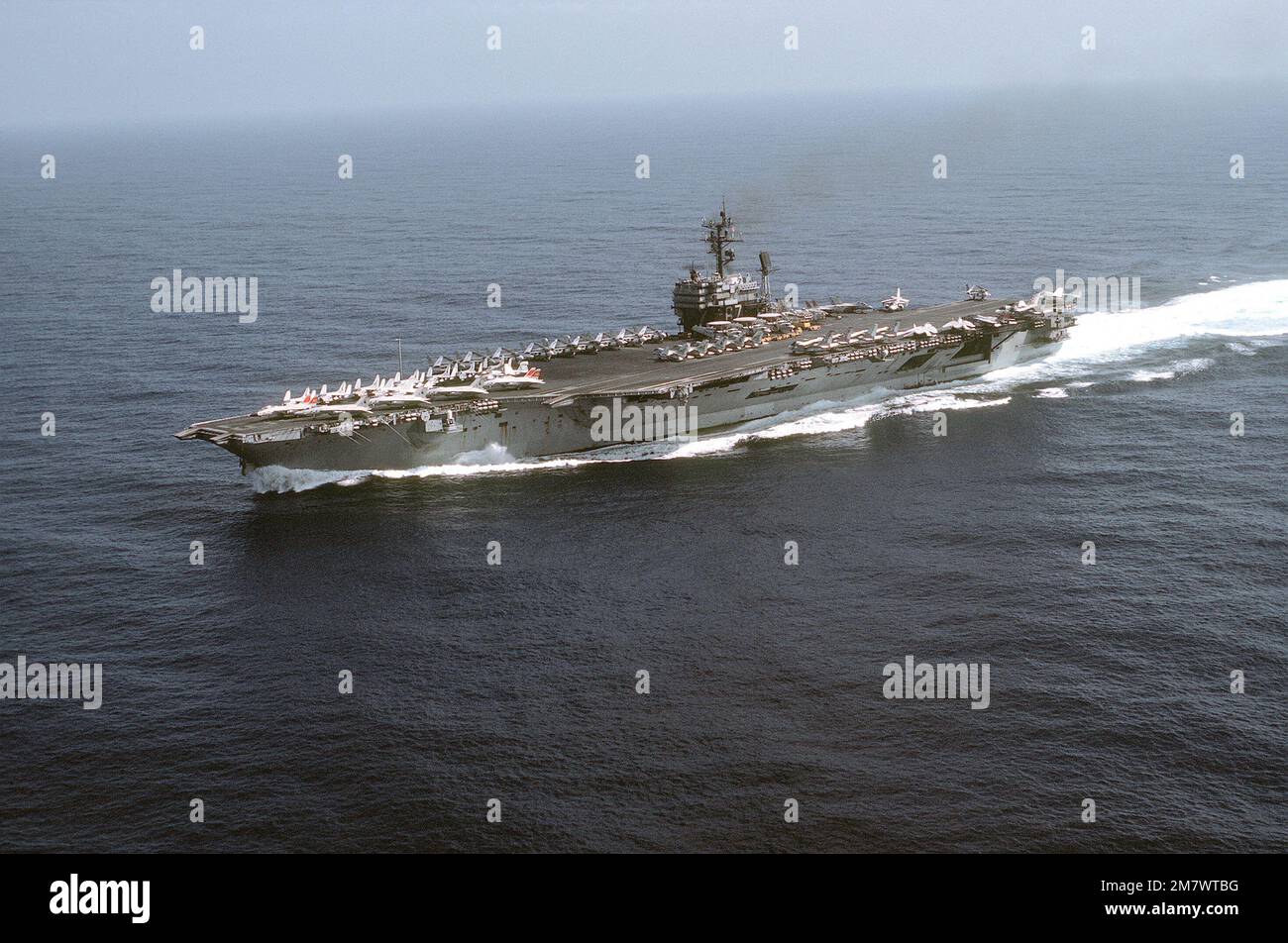 An aerial port bow view of the attack aircraft carrier USS JOHN F ...