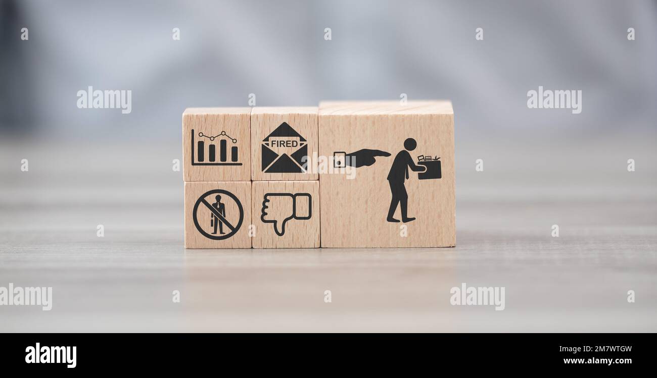 Wooden blocks with symbol of job loss concept Stock Photo - Alamy