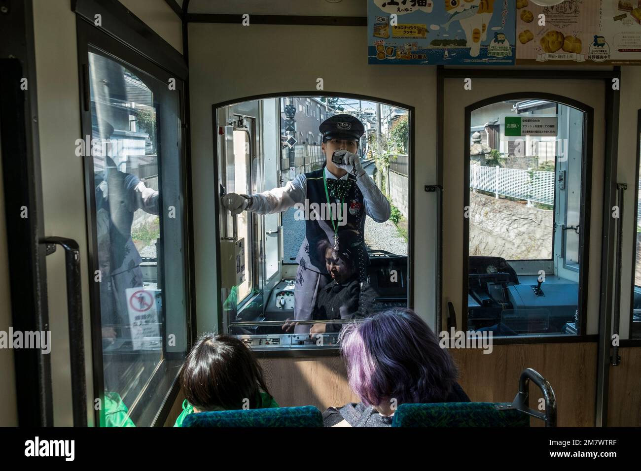 Japan, Honshu Island, Kamakura: woman driving an Enoden train. Train ...