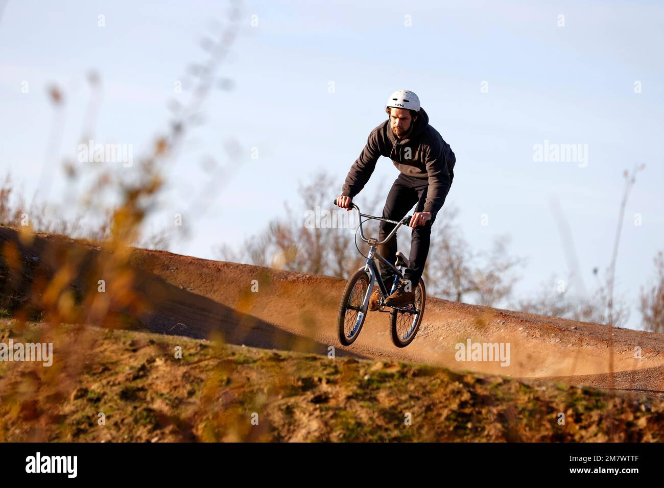 People jump their mountain bikes at a BMX and pump track in Fleet ...
