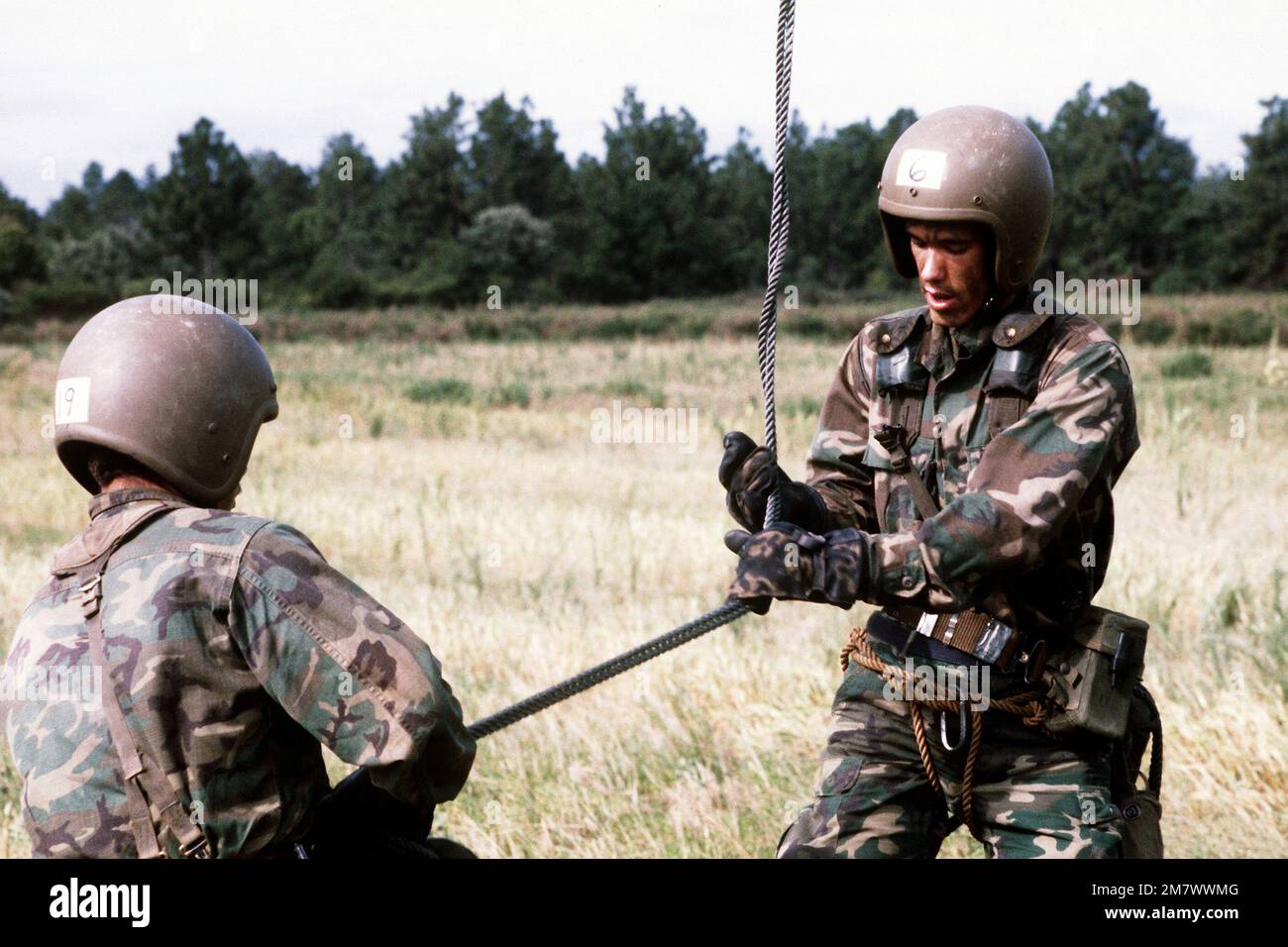 Combat Control School students complete a rappel from a hovering UH-1 ...