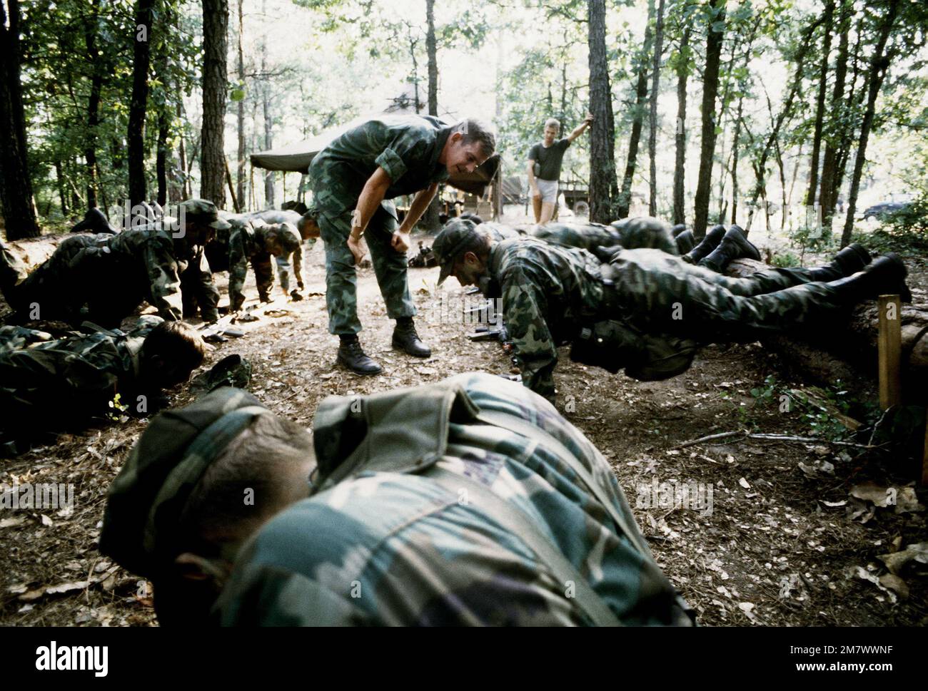 Combat Control School students are doing tough push-ups under the ...