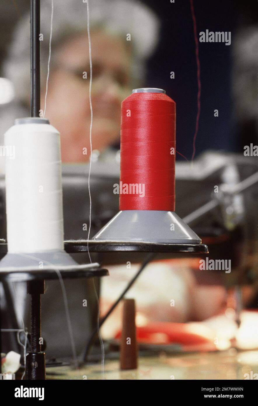 Red and white thread used in producing the United States flag at the ...